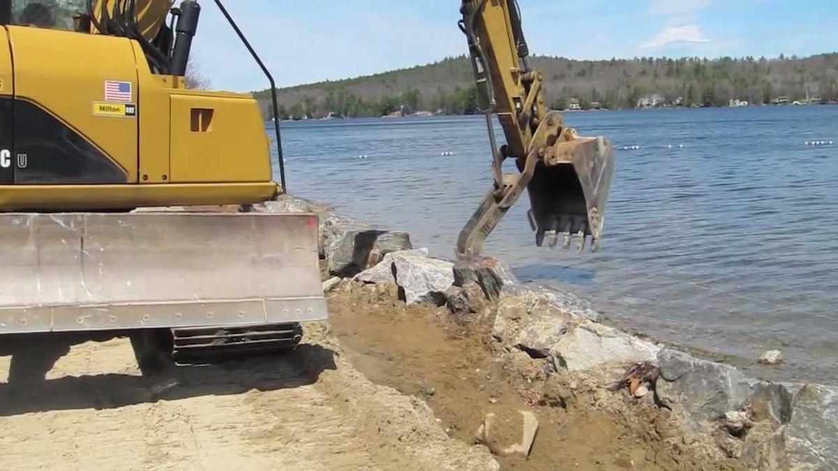 Excavator Moving Rocks